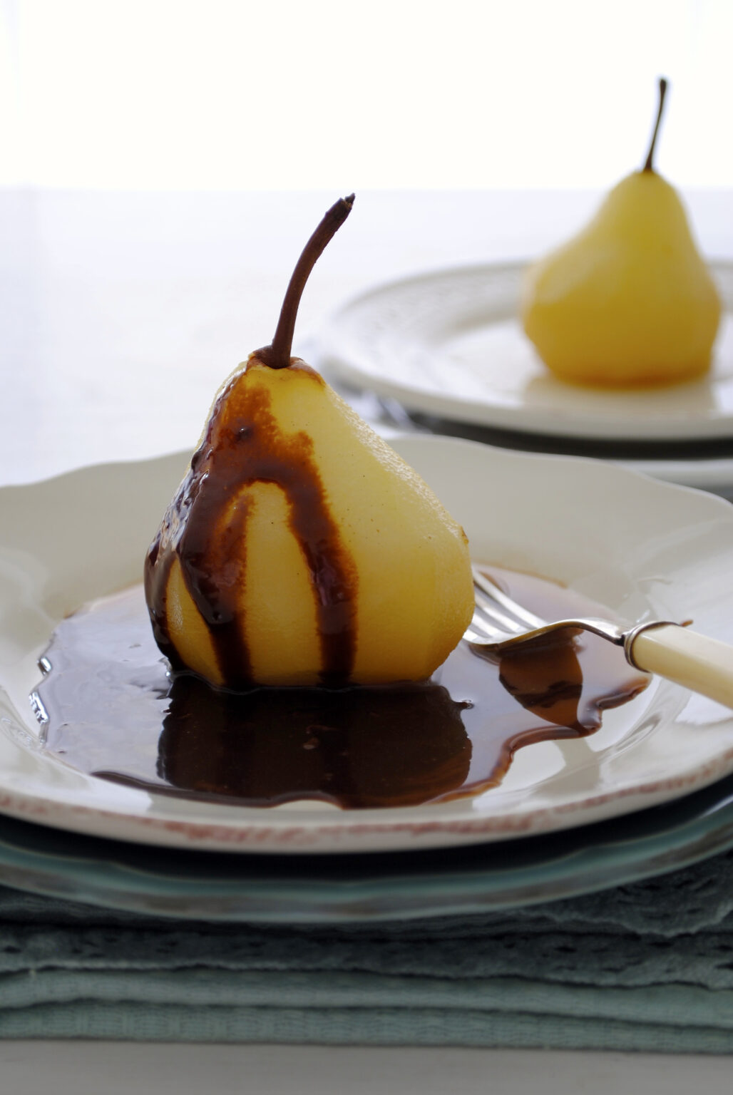 Peppered Poached Pears with Dark Chocolate Glaze - NOMU